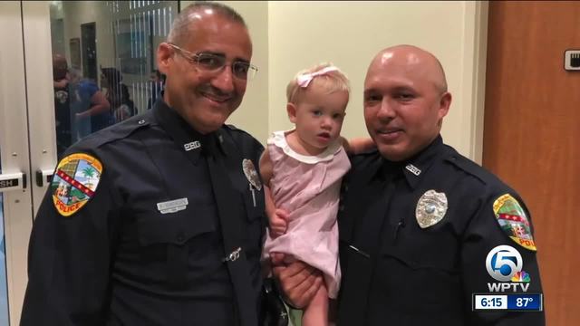 Palm Beach Gardens officers save choking baby Palm Beach Gardens officers save choking baby